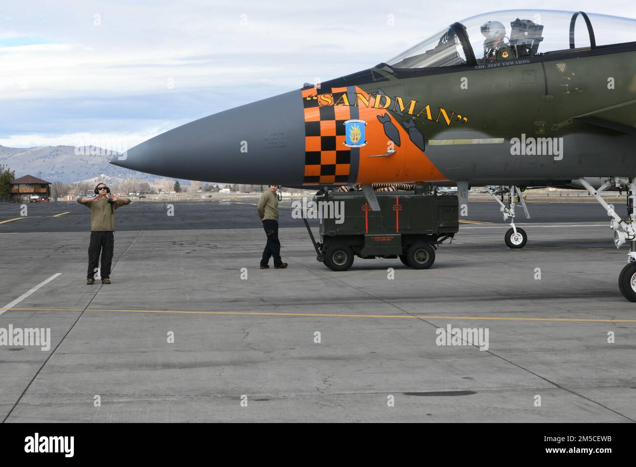 U.S. Air Force Tech. Sgt. Jonathan Stout, 550th Fighter Squadron F-15 crew chief, signal out an ...