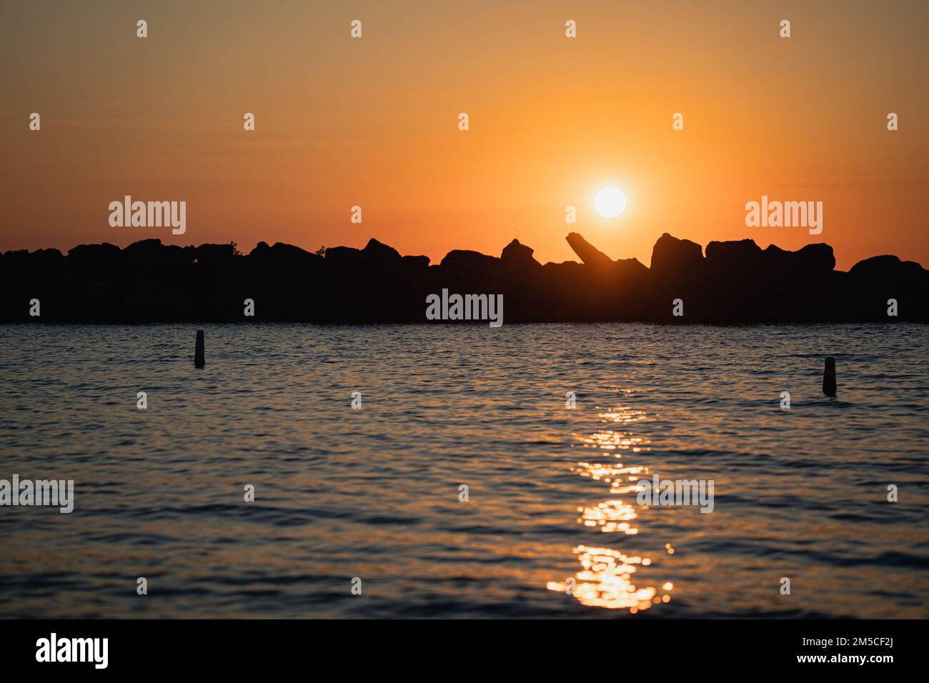 A scenic vivid sunset sky over the ocean Stock Photo - Alamy