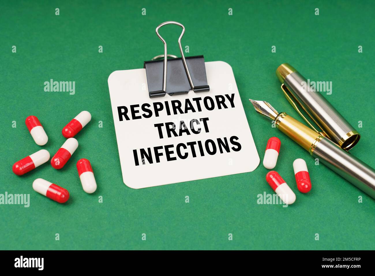 Medical concept. On the green surface of the tablet, a pen and a ...