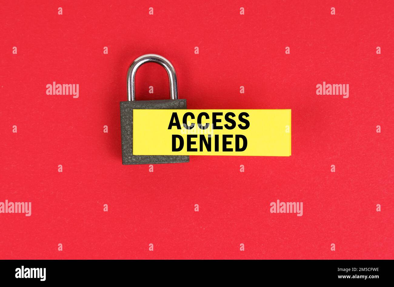 Business and security concept. On the red surface there is a lock with ...