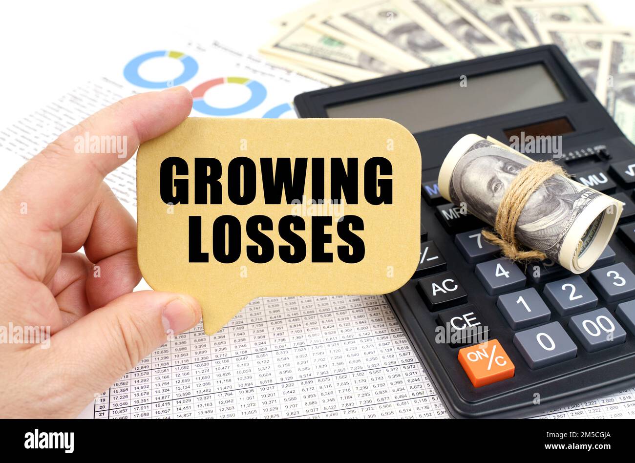 Business concept. Against the background of a calculator, documents and ...