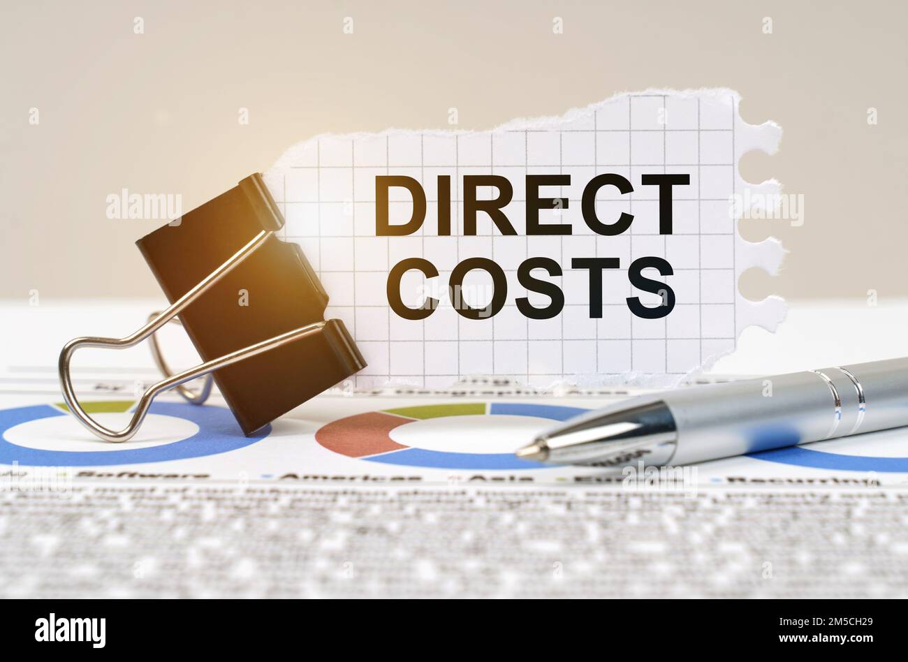 Business concept. On the table are reporting charts, a pen, in a clip ...