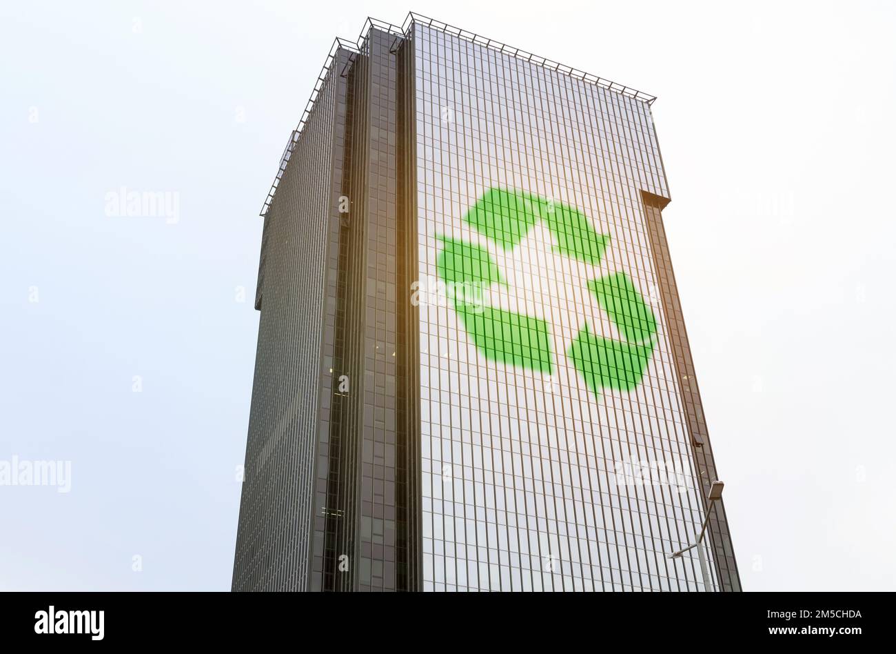 Ecological concept. A symbol is depicted on the glass surface of the ...