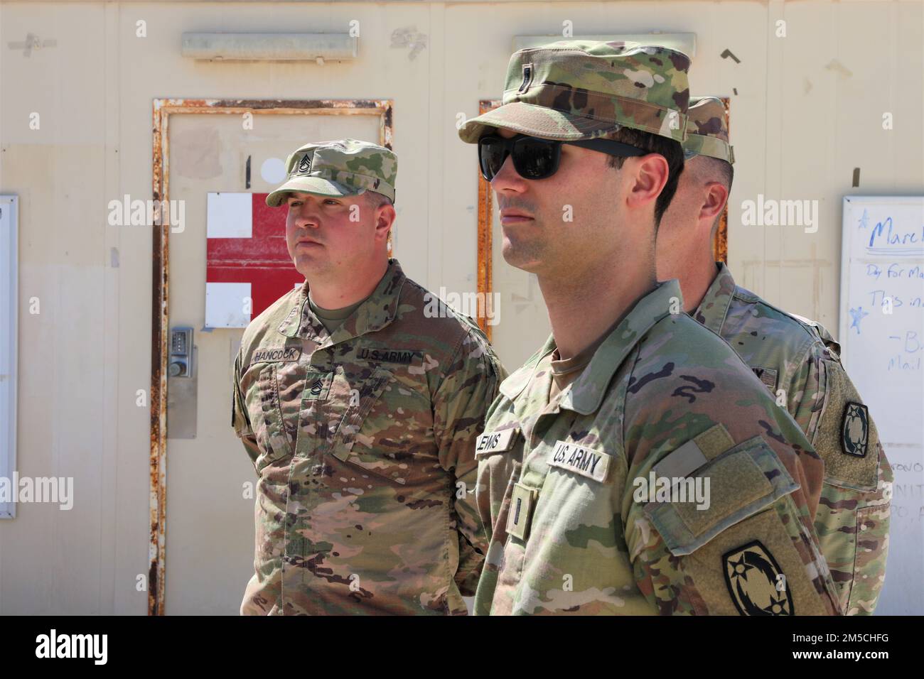 Leaders from Bravo Battery 1-44 Air Defense Artillery watch as two of ...