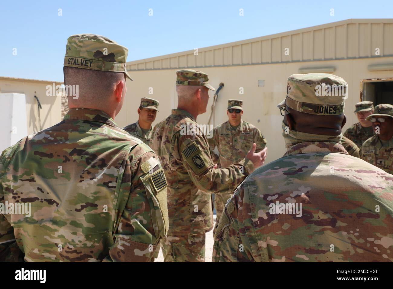 Capt. Stalvey (left) and 1st Sgt. Jones (right) listen to Stewart ...
