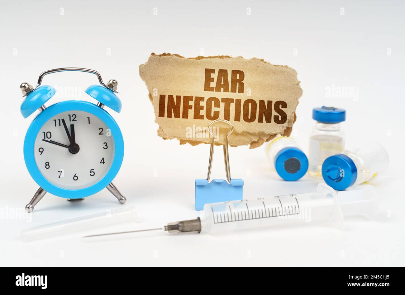 Medical concept. Near the stethoscope are a syringe, ampoules and a ...