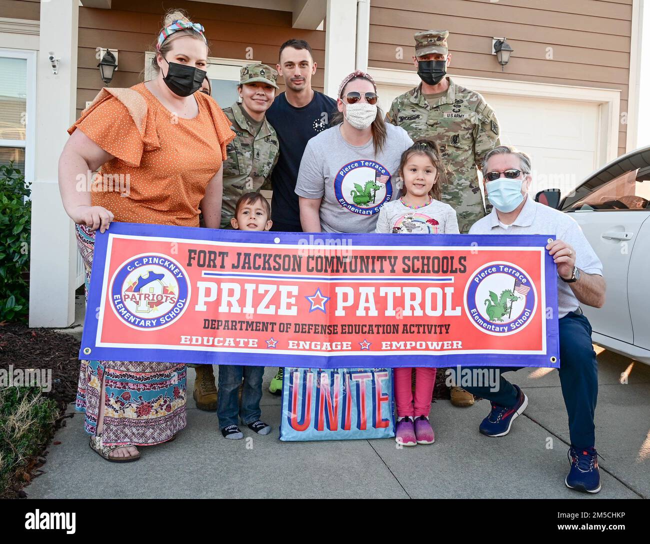 Kierra Trusty, right, and his Family are presented with a bag of ...