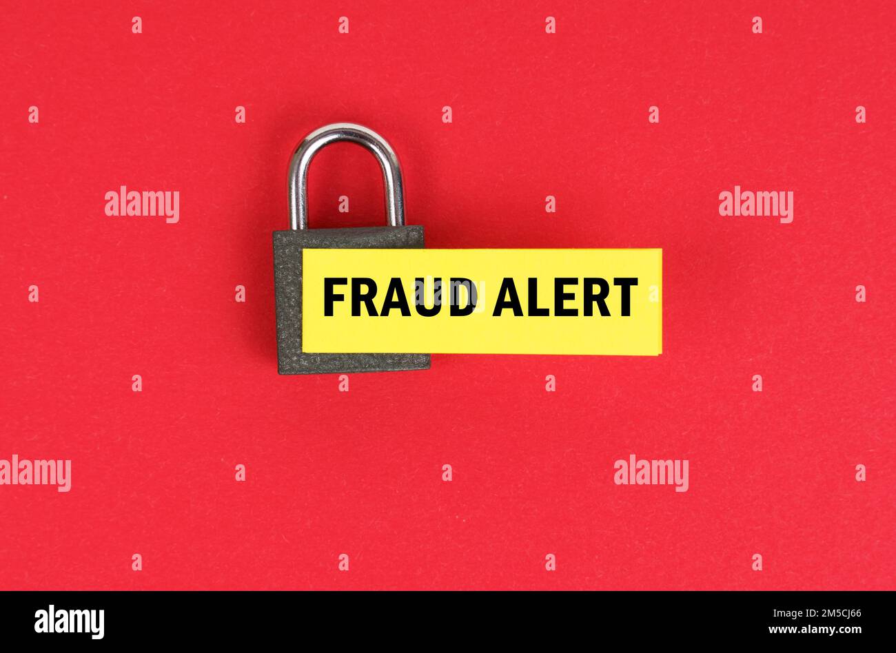 Business and security concept. On the red surface there is a lock with ...