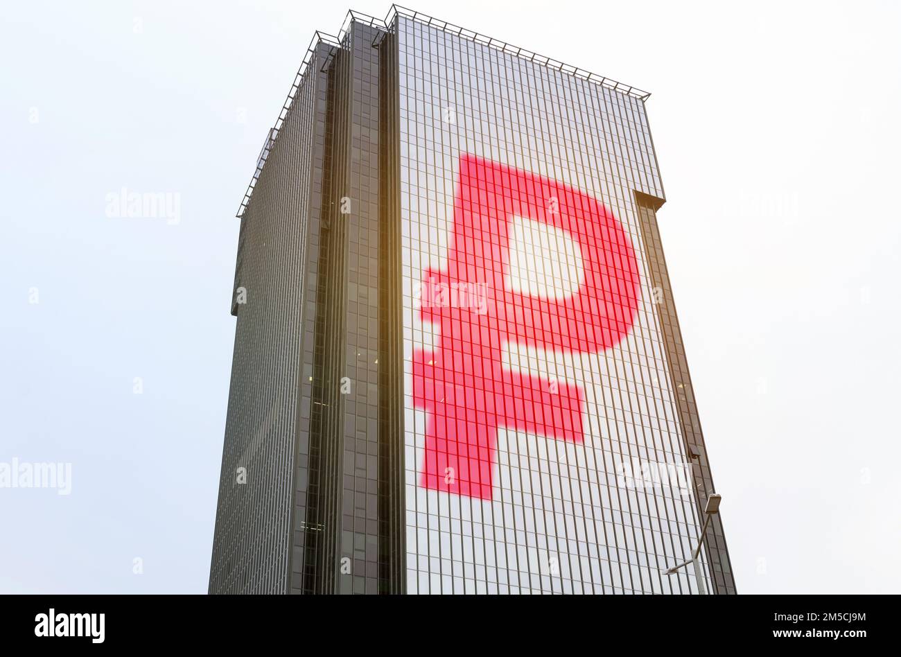 Business concept. A symbol is depicted on the glass surface of the ...