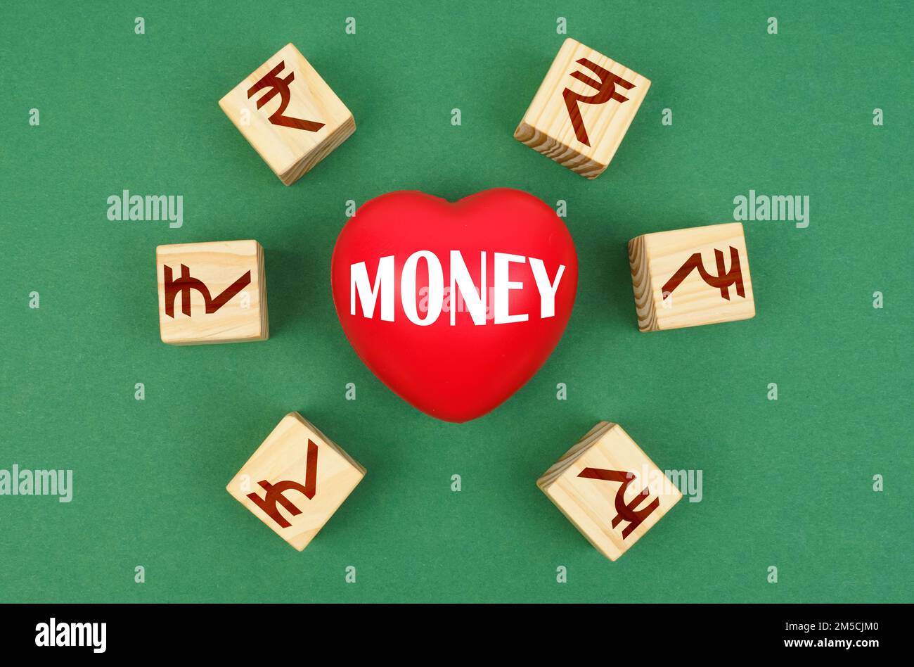 Finance concept. On a green surface, a heart with the inscription ...