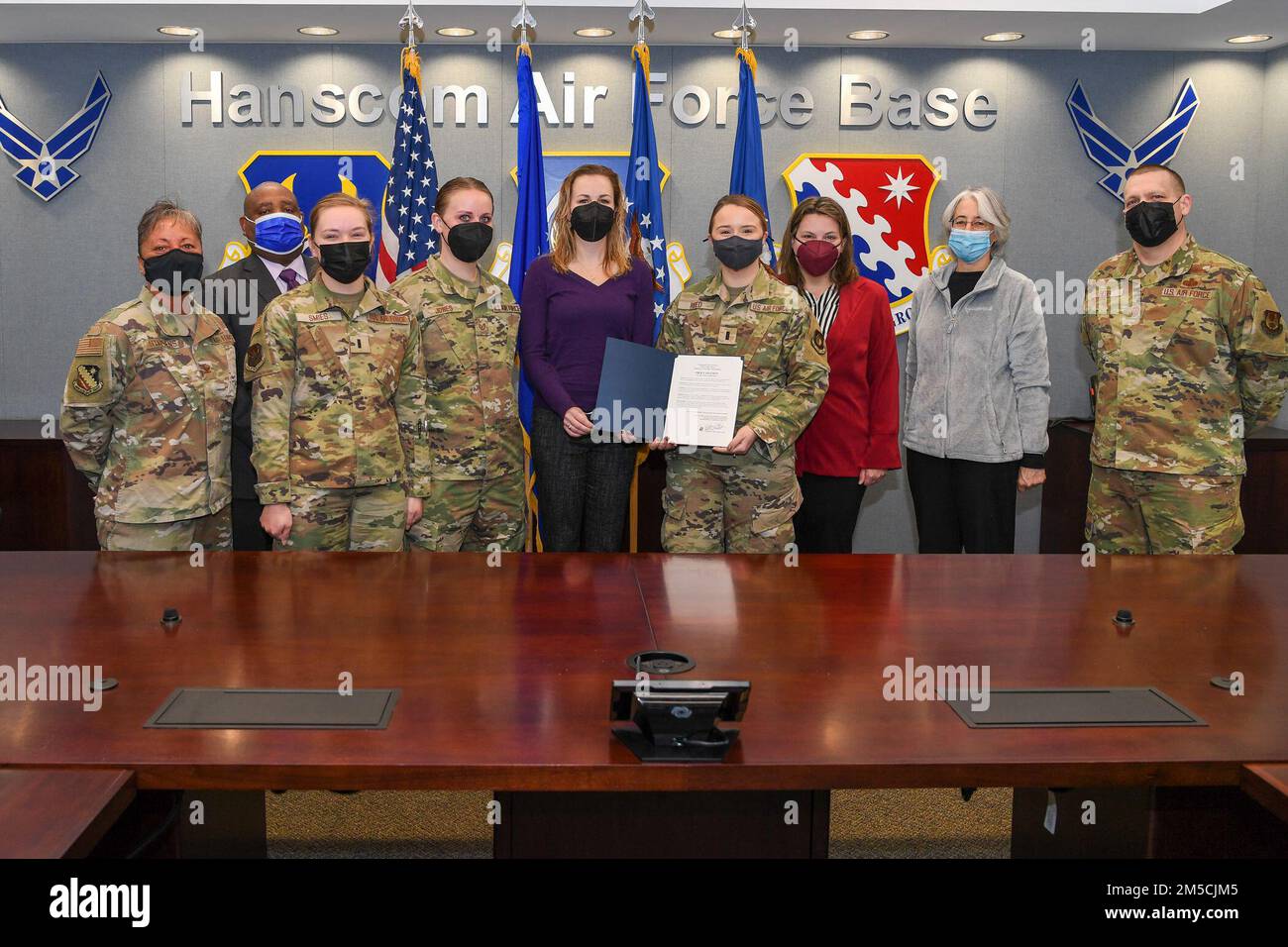 Following Col. Katrina Stephens, left, installation commander, signing ...