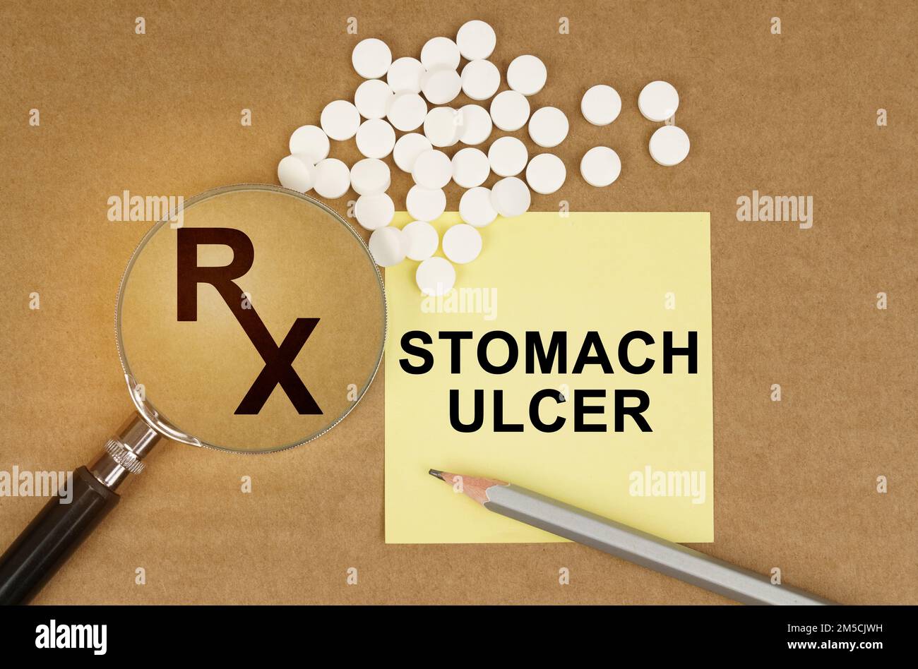 Medical concept. On the table are pills, a magnifying glass, pencils ...