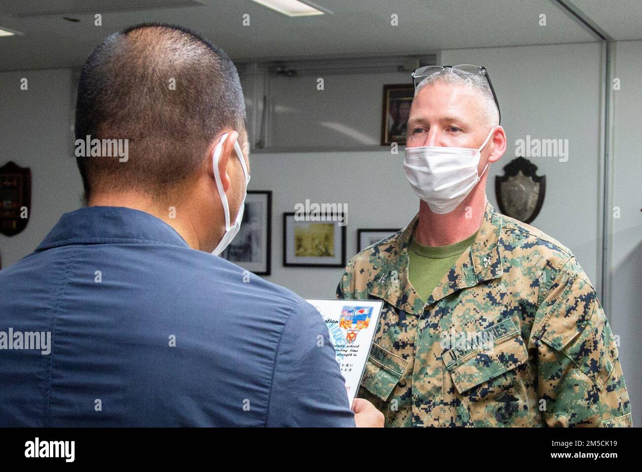 Col. Tracy receives a letter of appreciation from the principal of a ...