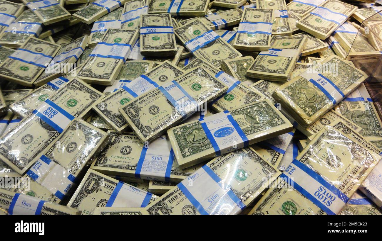 A pile of many 100 USD banknotes bills wrapped in currency straps Stock ...