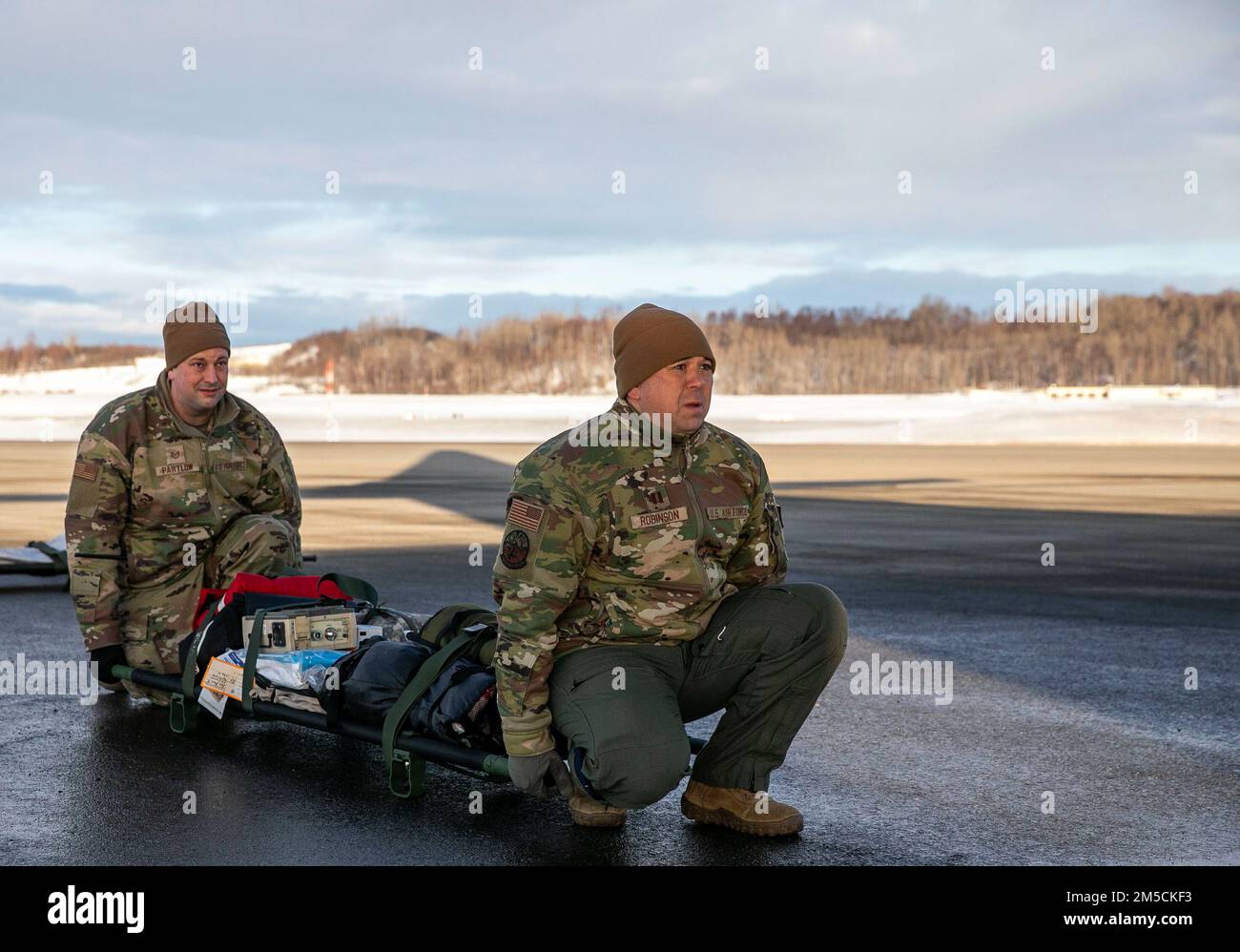 Critical care air transport team (CCATT) personnel load simulated ...