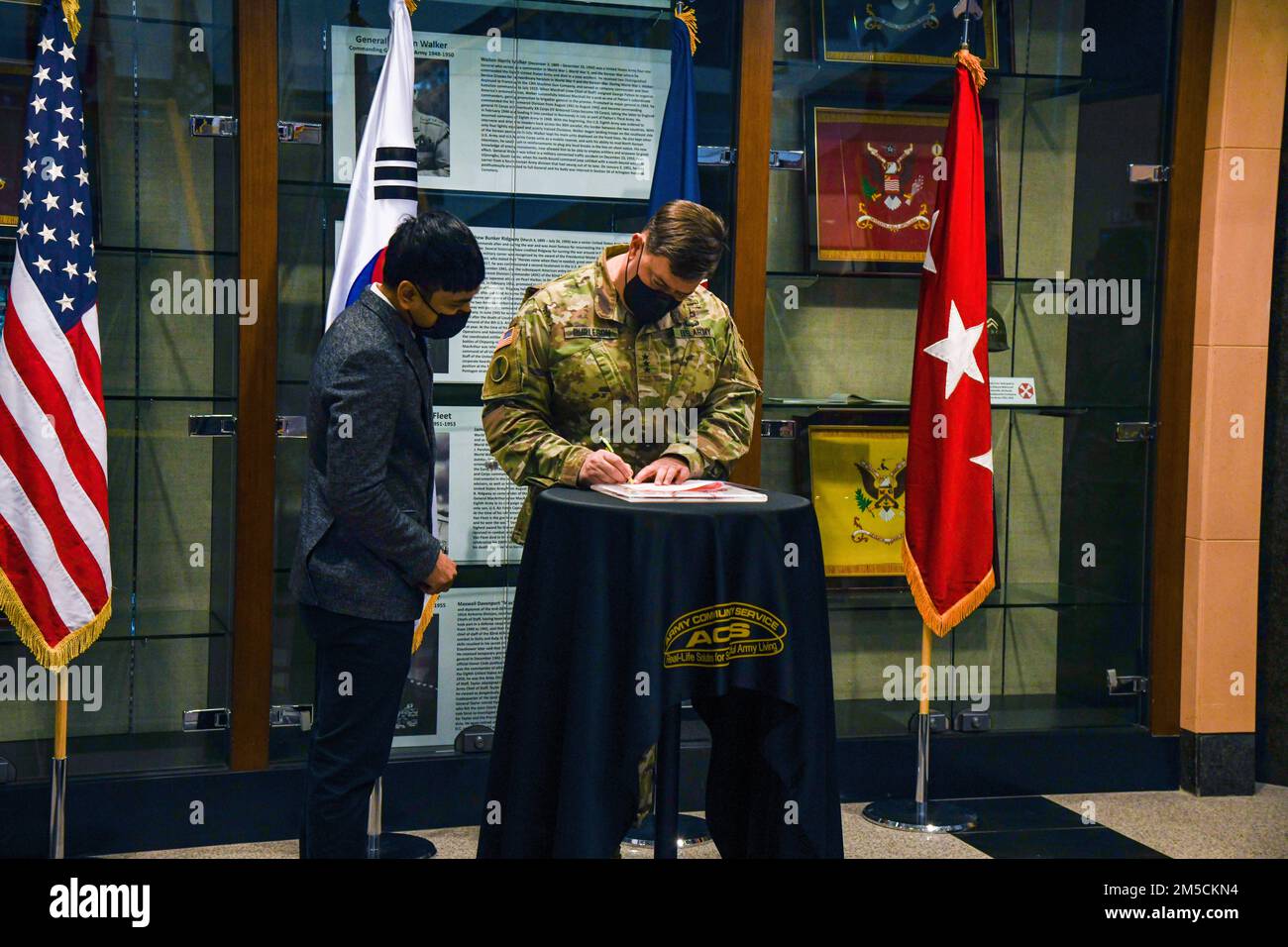Lt. Gen. Willard Burleson (right), commanding general of Eighth Army ...