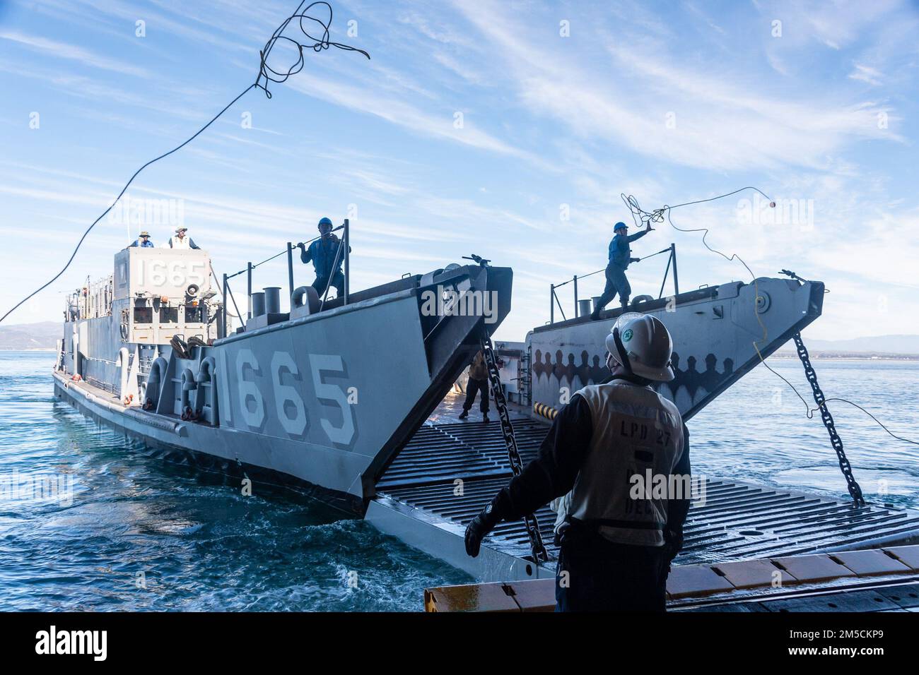220302-N-VQ947-1130 PACIFIC OCEAN (March 2, 2022) — Sailors throw lines ...