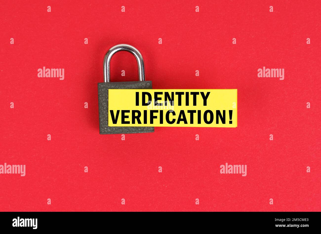 Business and security concept. On the red surface there is a lock with ...