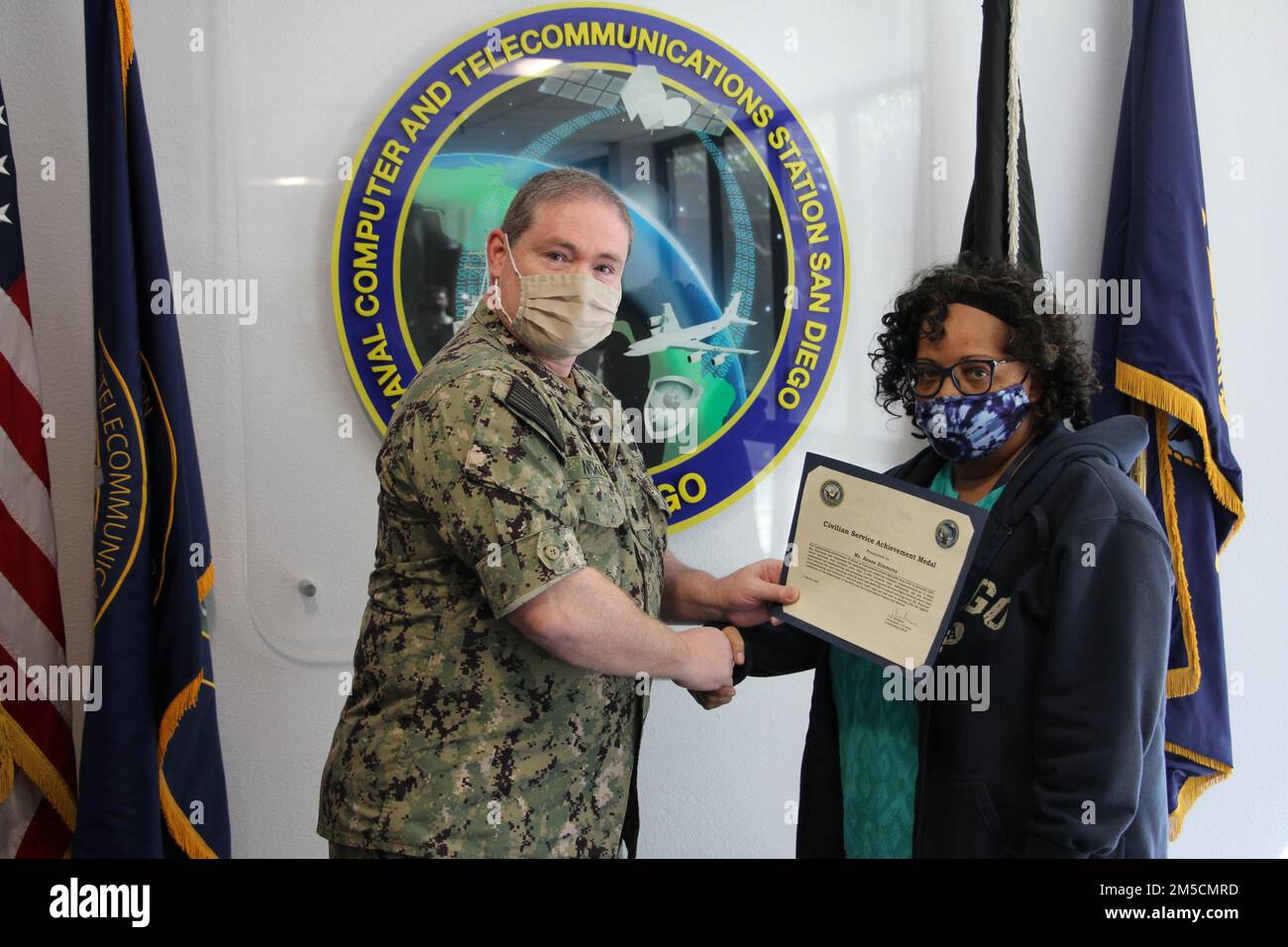 CDR Nichols awards Ms. Renee Simmons with a Civilian Service ...