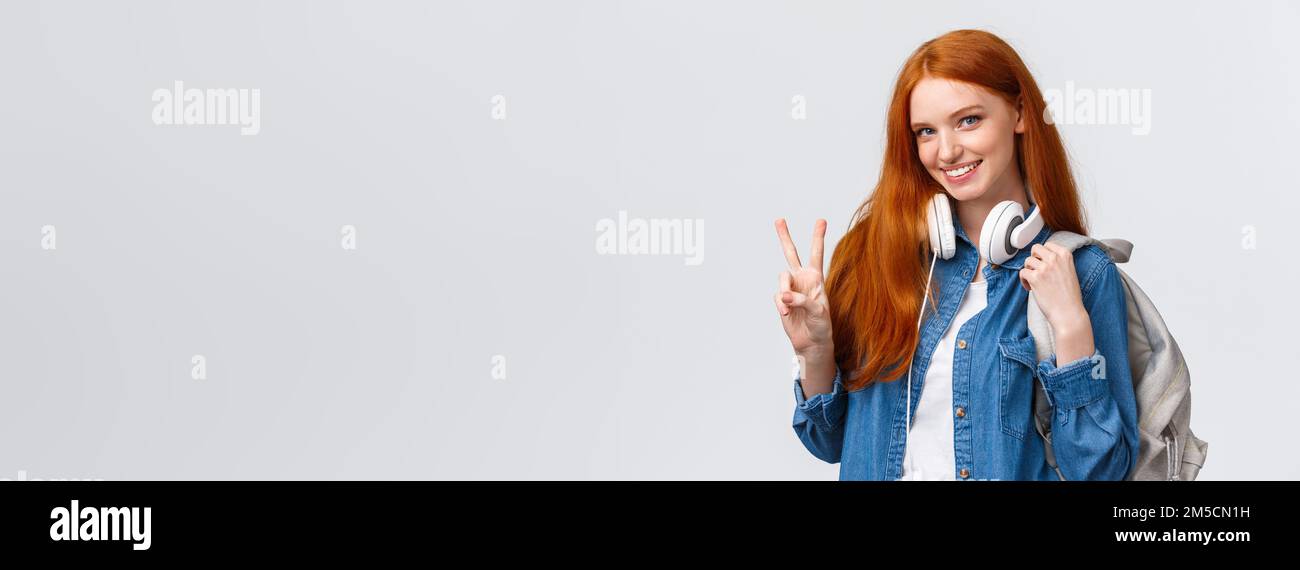 Lovely flirty and cheeky redhead college girl, wear headphones over ...