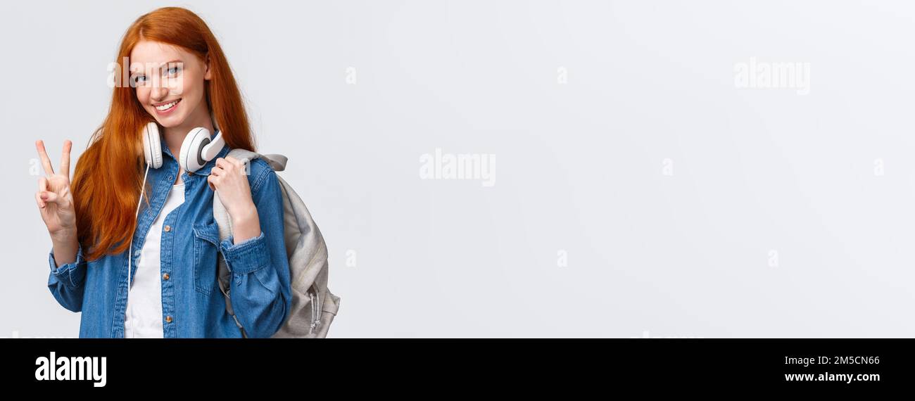 Lovely flirty and cheeky redhead college girl, wear headphones over ...