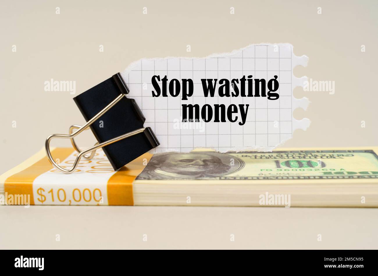 Business concept. On a gray surface is a pack of dollars on which there ...