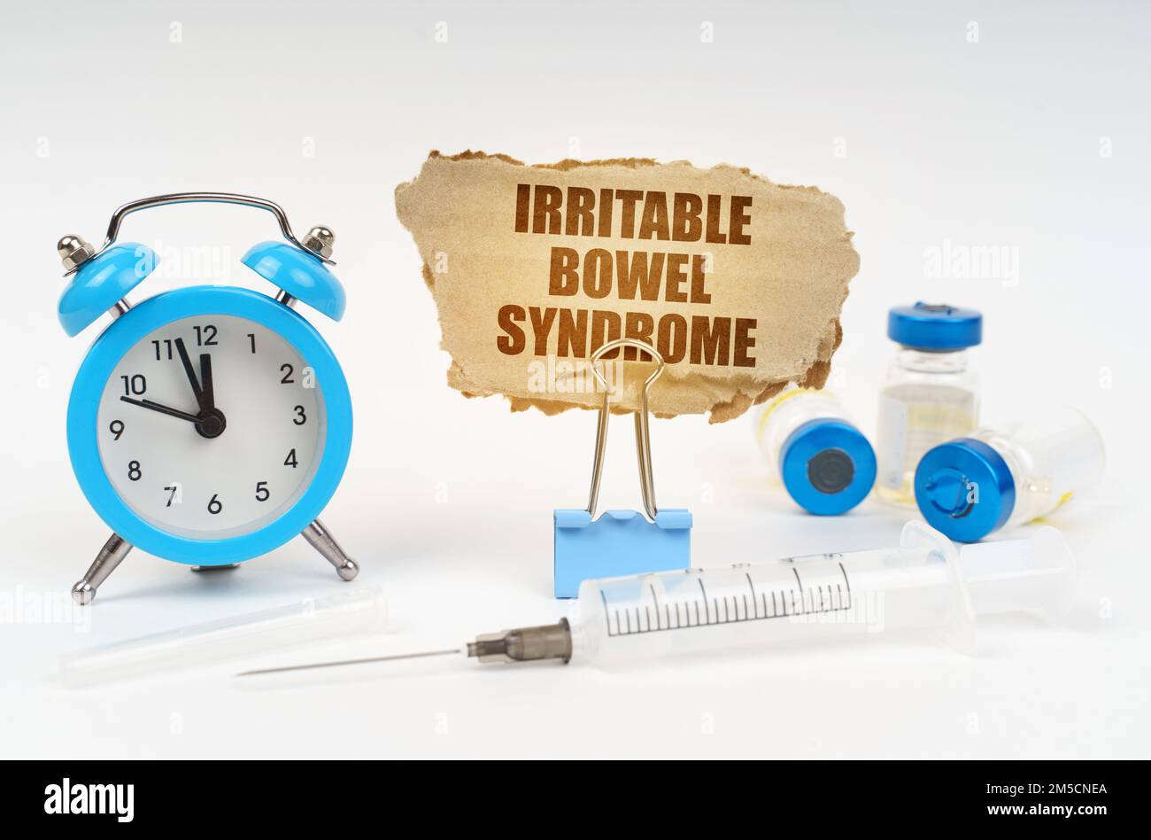 Medical concept. Near the stethoscope are a syringe, ampoules and a ...