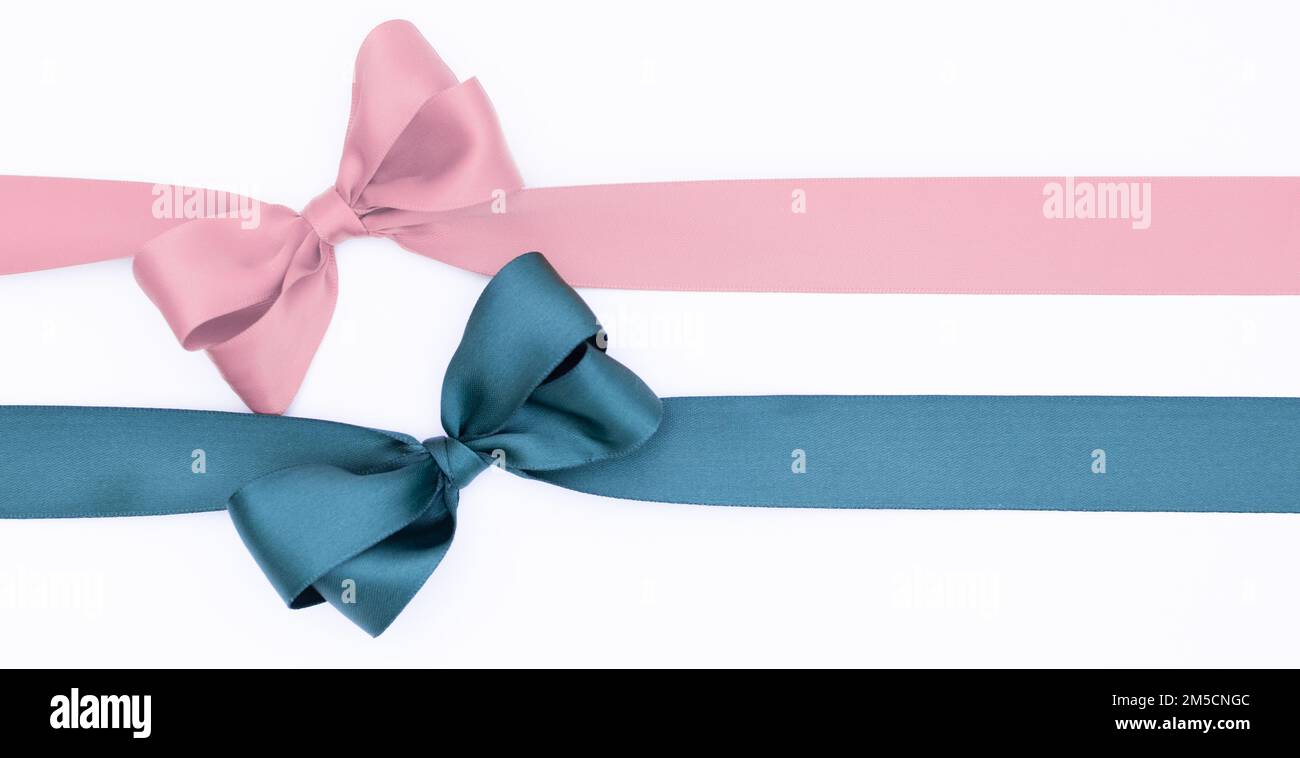 Satin ribbon bows for gift pack in gray and pink colors, isolated on ...