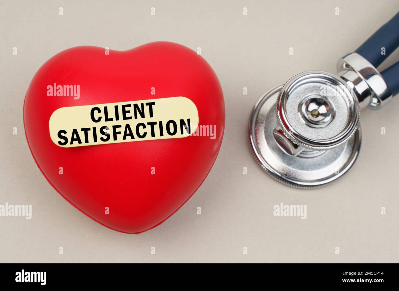 Medicine concept. Near the stethoscope lies a heart on which a sticker ...