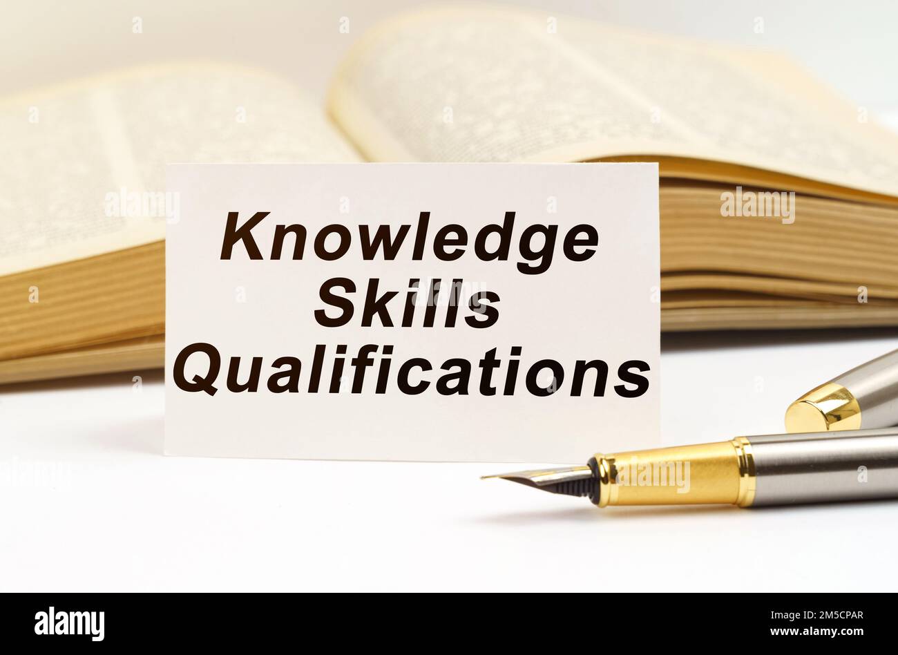 Education concept. Against the background of the book lies a pen and a ...