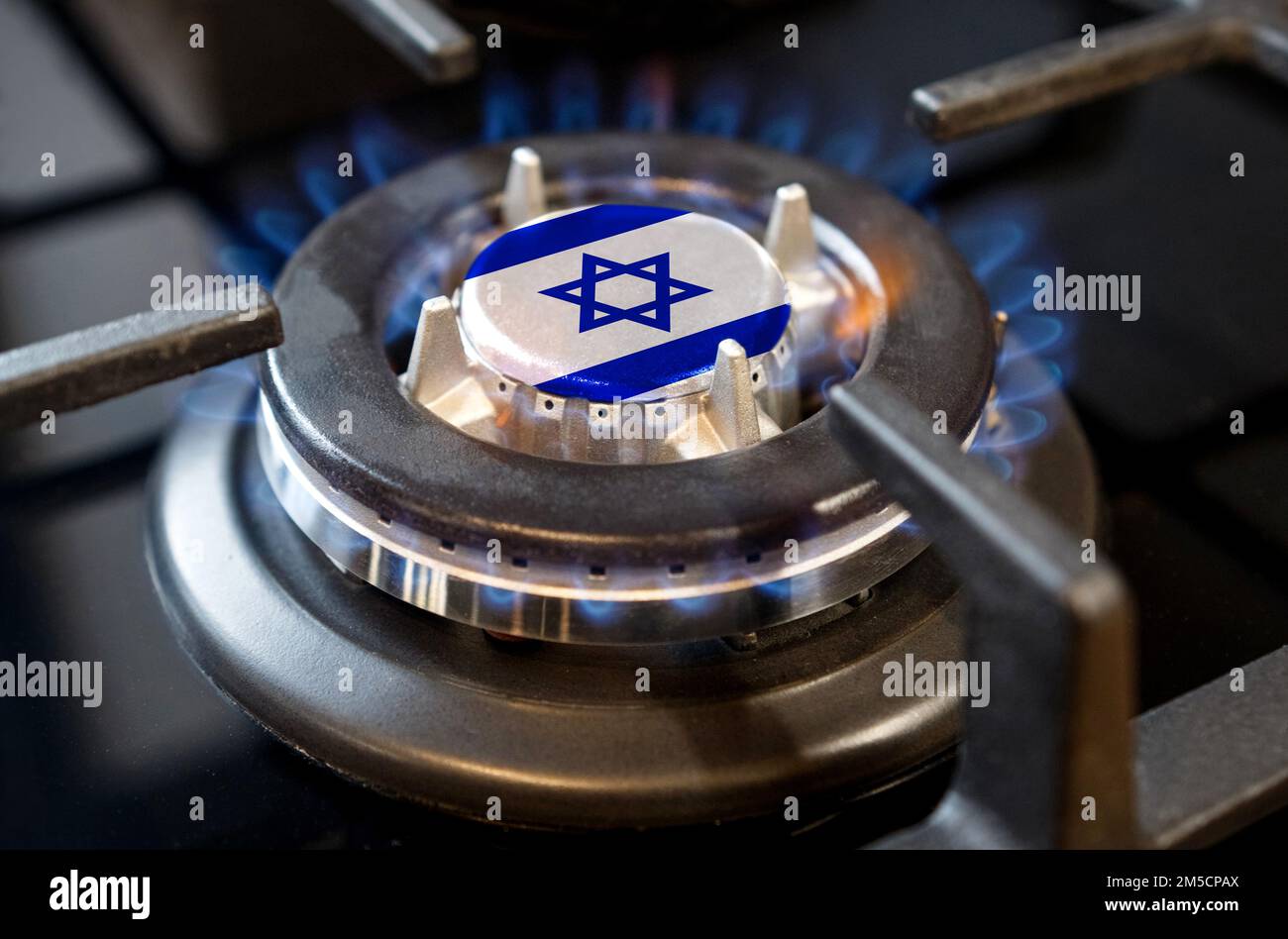 Gas import and export concept. A burning gas burner of a home stove, in ...