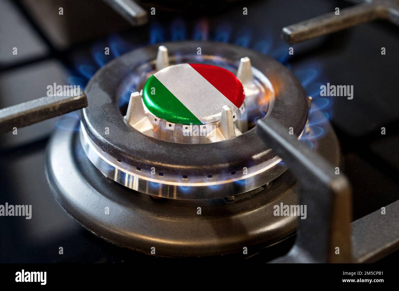 Gas import and export concept. A burning gas burner of a home stove, in ...