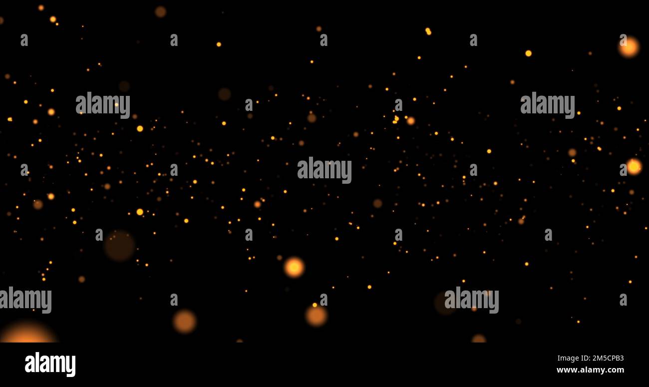 Flying luminous particles of different sizes on a black background ...