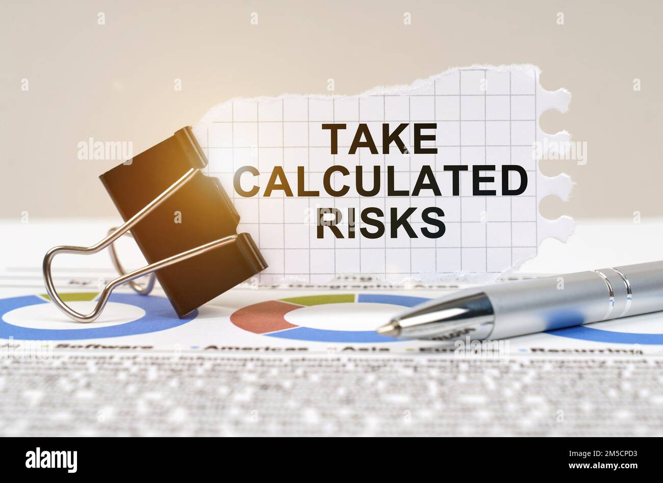 Business concept. On the table are reporting charts, a pen, in a clip ...