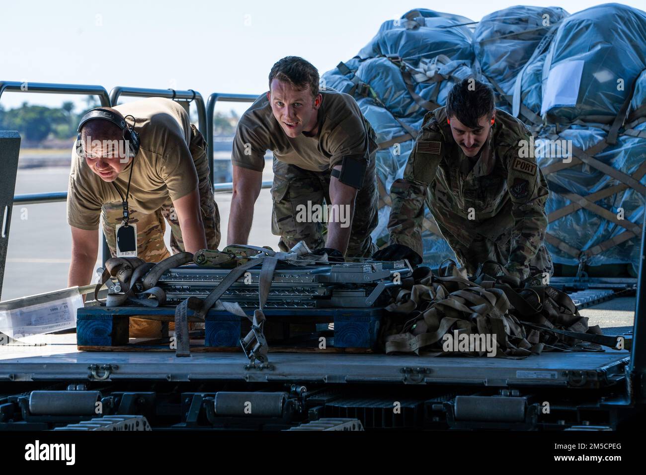 Members assigned to the 647th Logistics Readiness Squadron load cargo ...