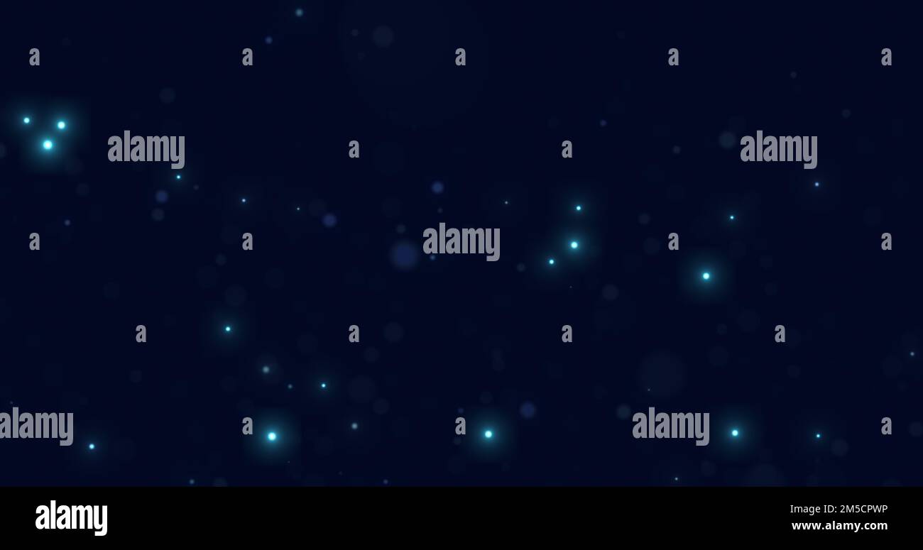 Glowing and sparkling blue particles fall in space on a blue background ...