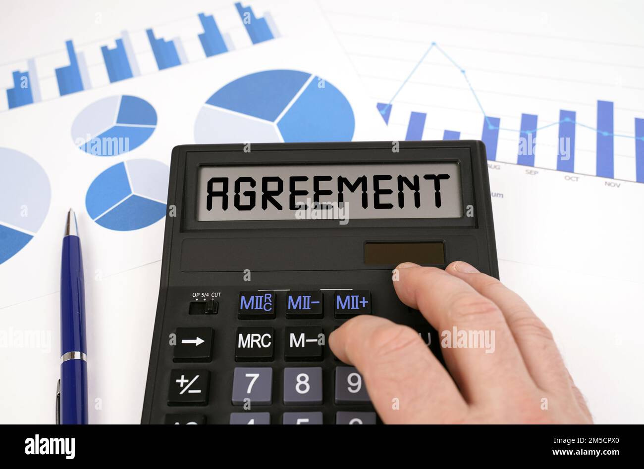 Business concept. There is a calculator on documents with graphs and ...