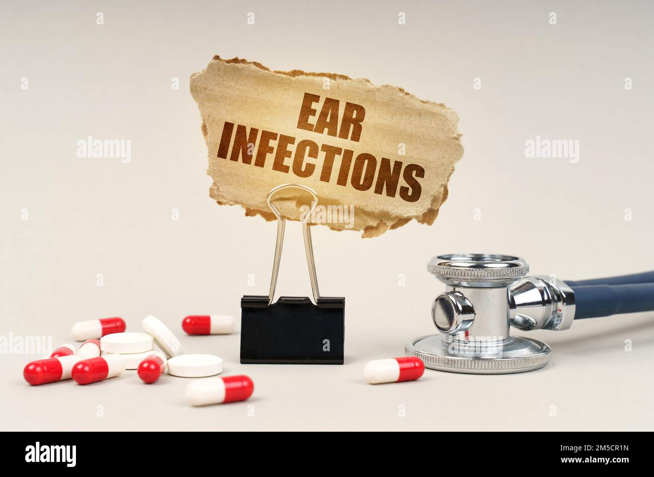 Medical concept. Near the stethoscope are pills and a clip with a ...