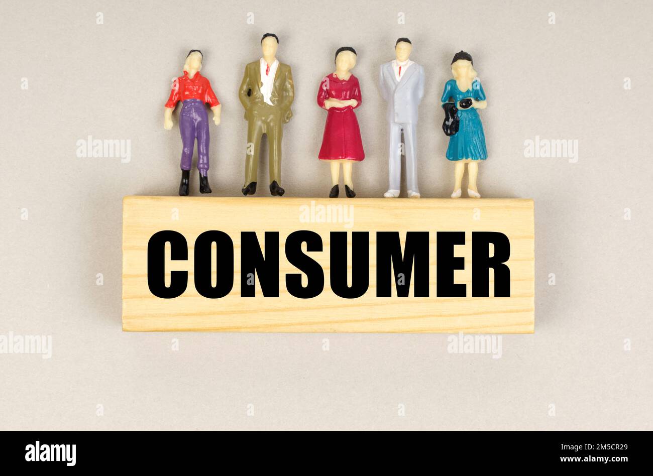 Business concept. On the block with the inscription - CONSUMER there ...