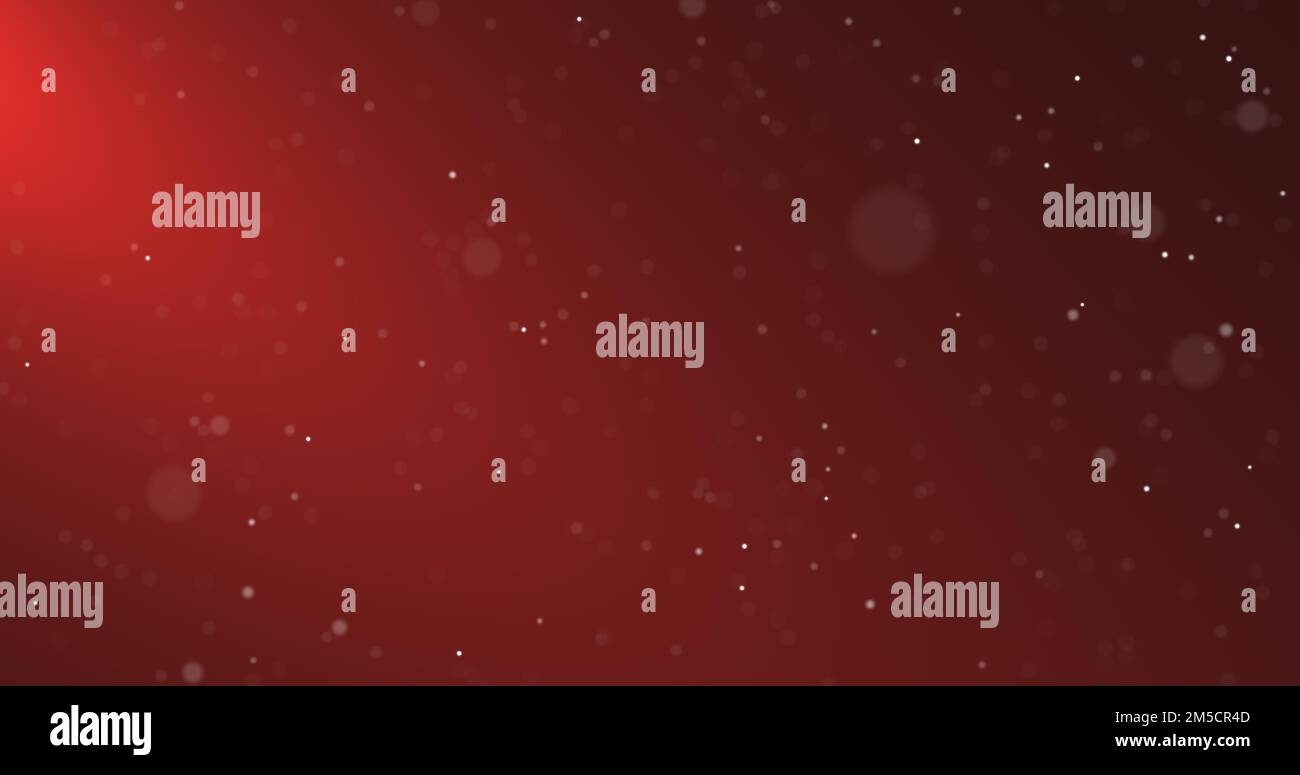 Slowly moving particles in red light. Falling snow in the light of a ...