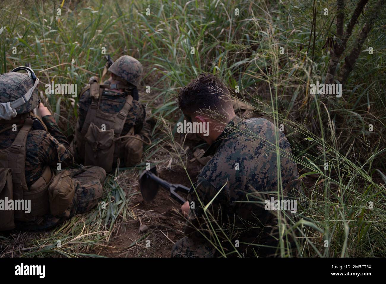 U.S. Marines with Marine Wing Support Squadron 174 dig fighting holes ...