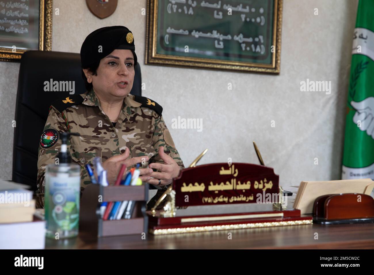 Maj. Muzhda, Peshmerga female battalion commander, briefs members of ...