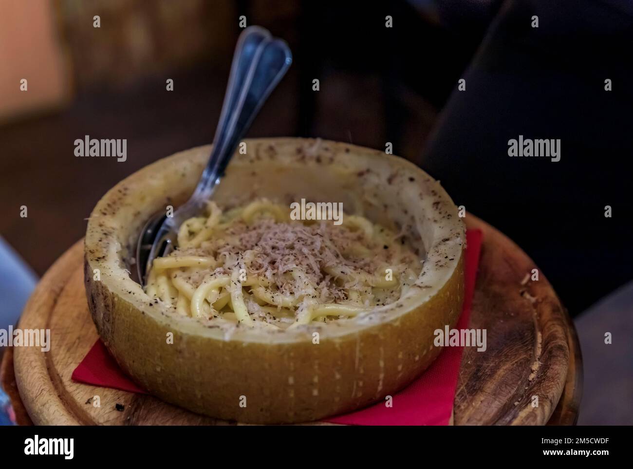 Fresh pasta with truffle sauce, cooked in a pecorino cheese wheel with ...