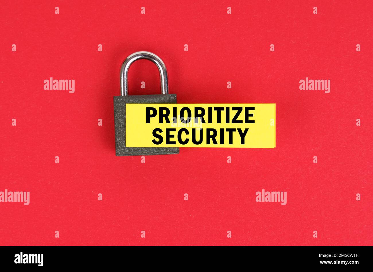 Business and security concept. On the red surface there is a lock with ...