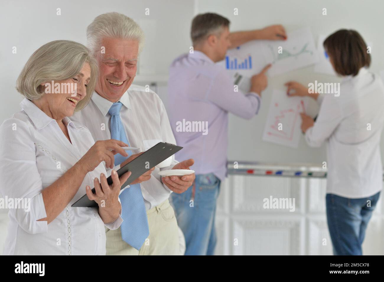 different generations work in the family business Stock Photo - Alamy