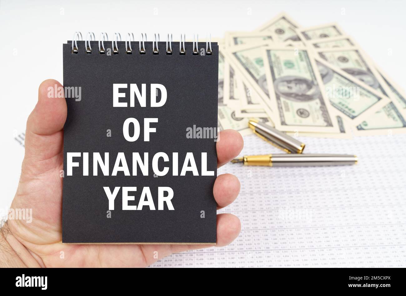 Business concept. In the man's hand is a notepad with the inscription ...