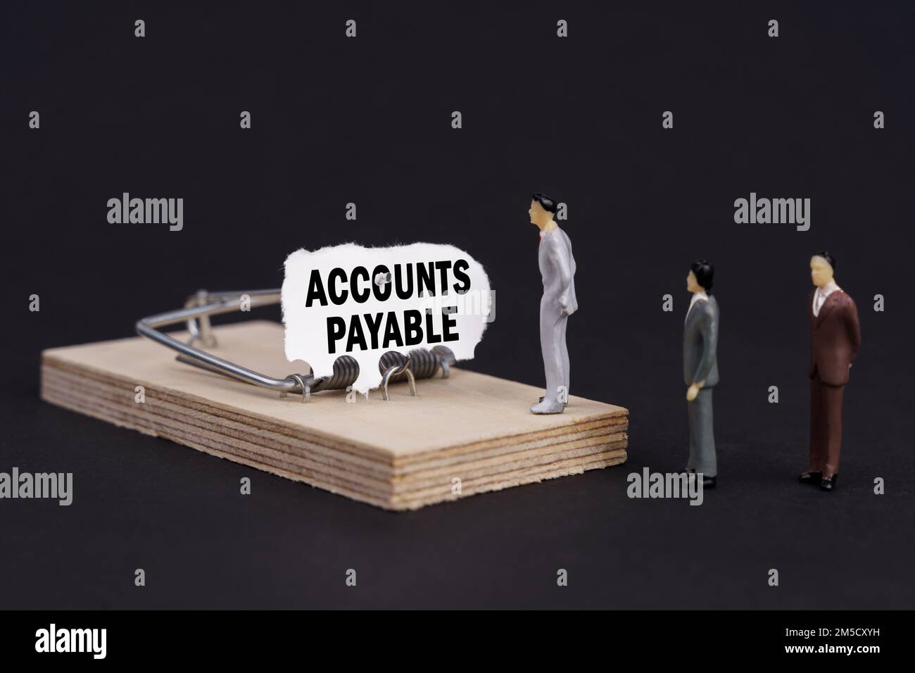 Business trap, crisis concept. Figures of businessmen stand near a ...