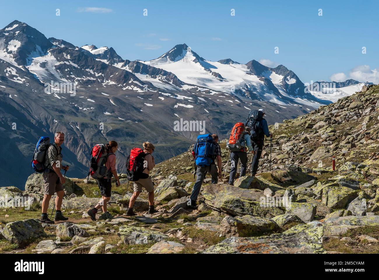 The image is of mountain walkers trekkers in the Oetztal Alps in the ...