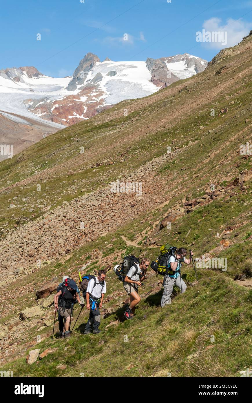 The image is of mountain walkers trekkers in the Oetztal Alps in the ...