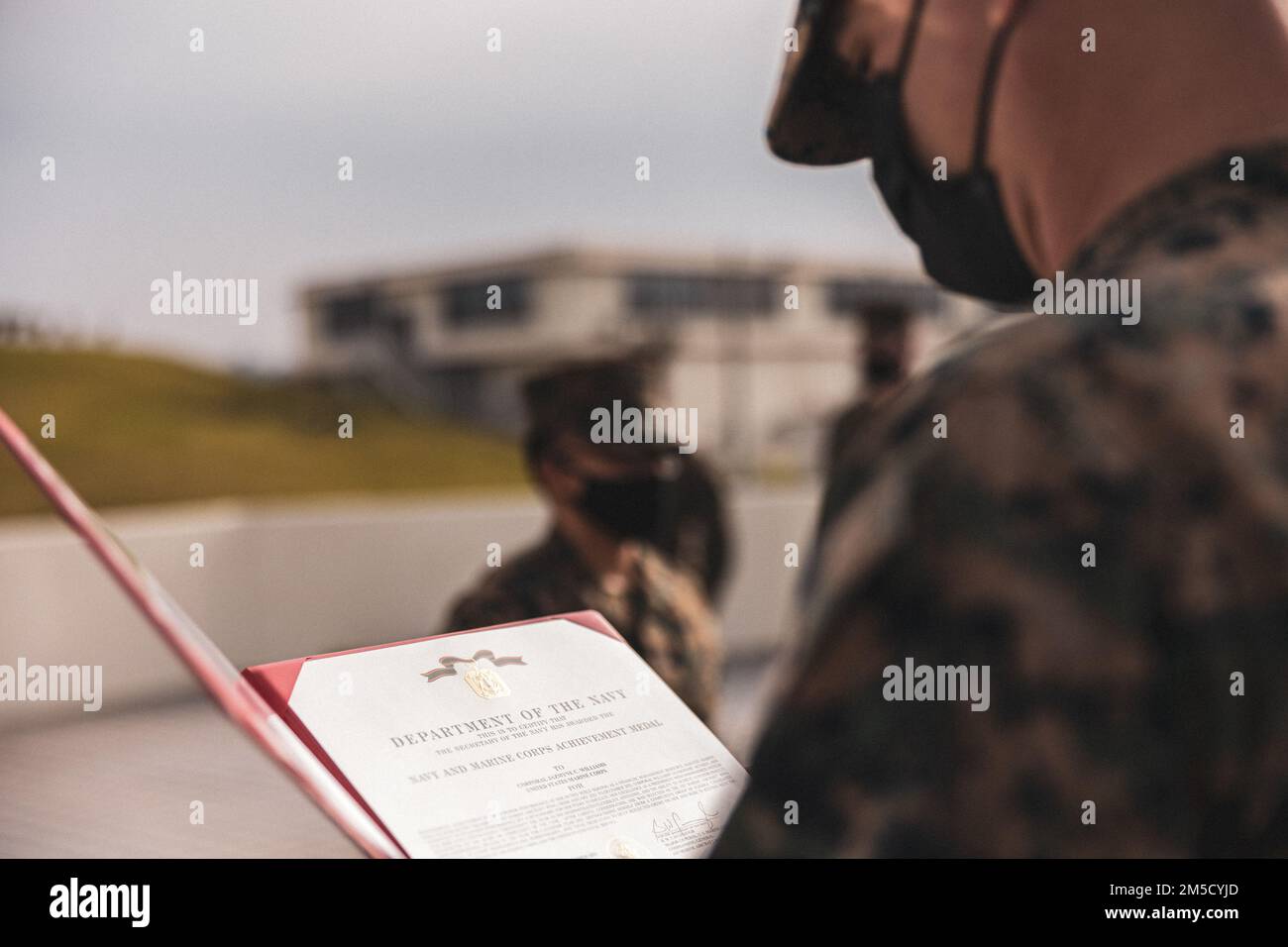 U.S. Marine Corps Cpl. Jazmyne Williams receives a Navy and Marine ...
